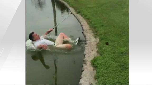 Golfer falls into pond after a daring shot - ESPN Video