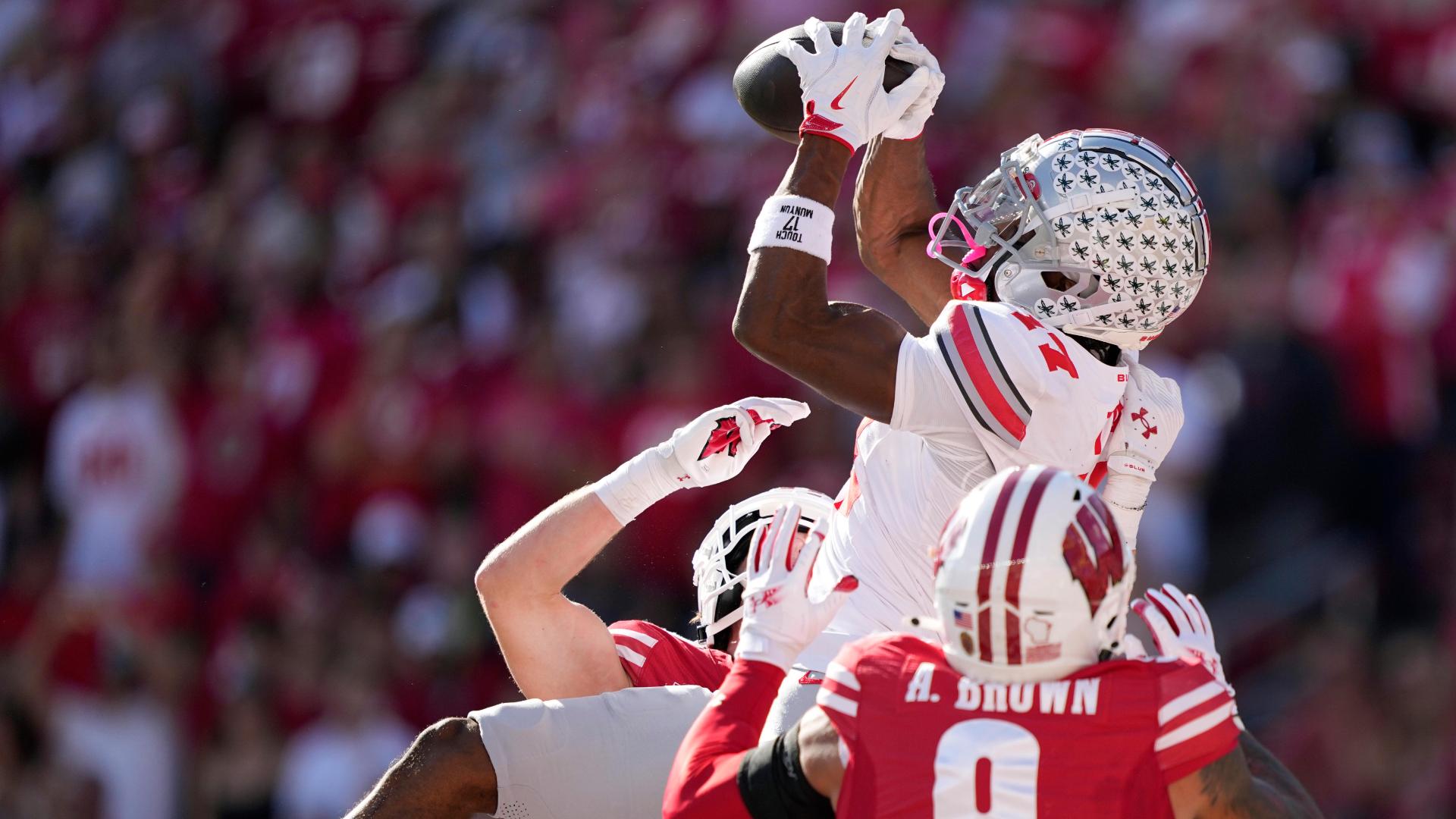 Carnell Tate rises over 2 Wisconsin defenders for an Ohio State TD ...
