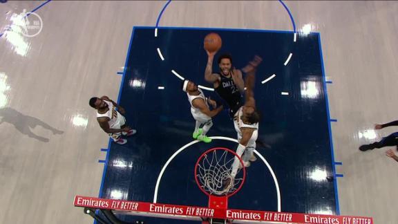 P.J. Washington fights off defenders for the basket plus the foul ...